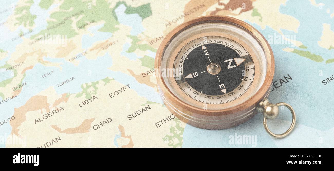Compass on world map, closeup. Banner design with space for text Stock ...