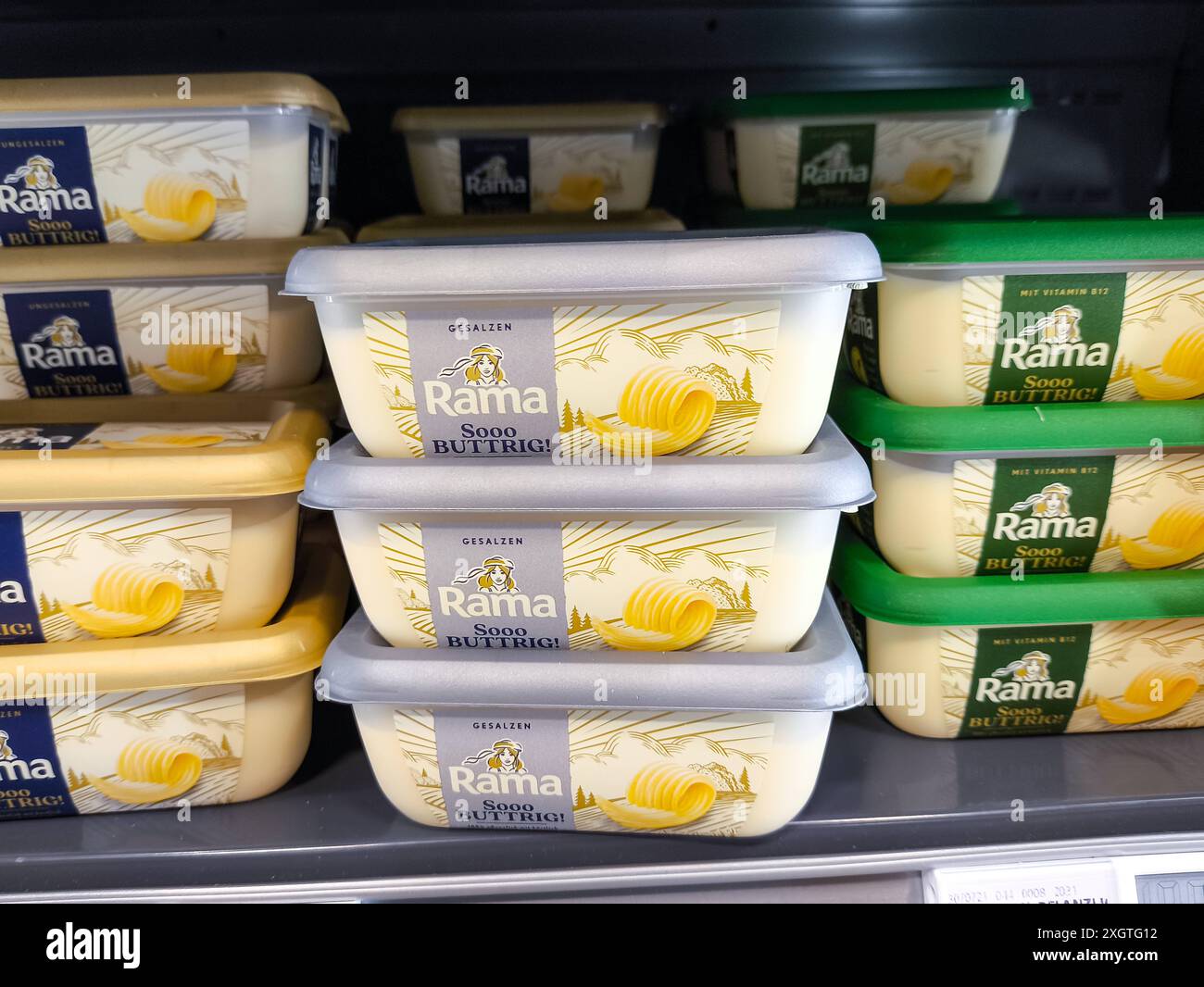 Bavaria, Germany - July 10, 2024: Packs of Rama margarine in a chiller ...