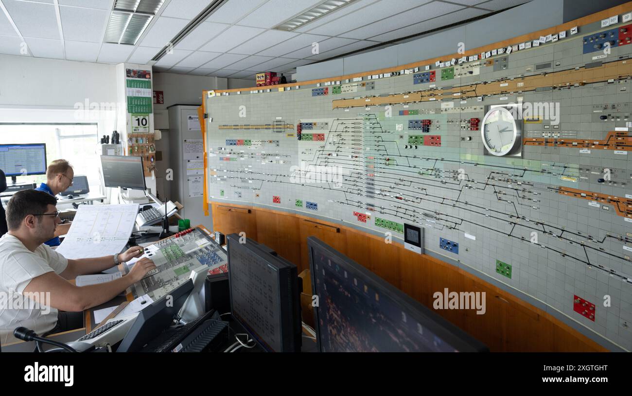 10 July 2024, Bavaria, Donauwörth: A dispatcher sits in the station in ...