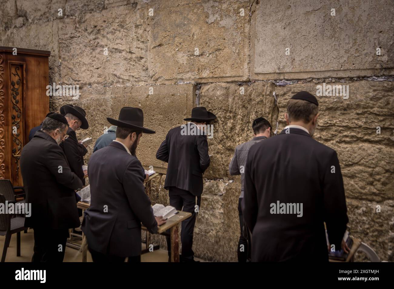 Several ultra-orthodox Jews (haredi) reading Torah in front of the ...