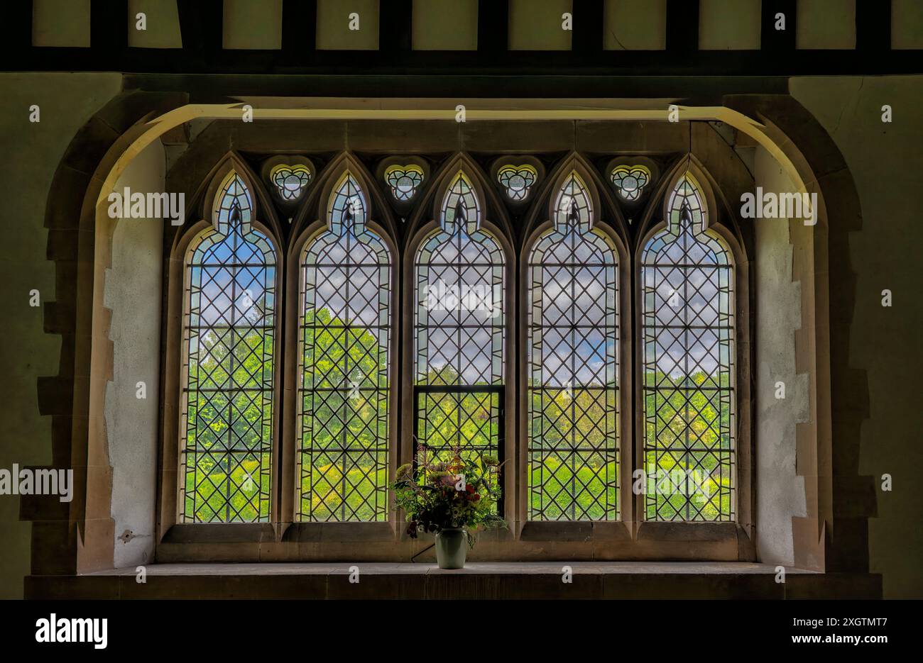 Leaded ornate church window flower vase Stock Photo - Alamy