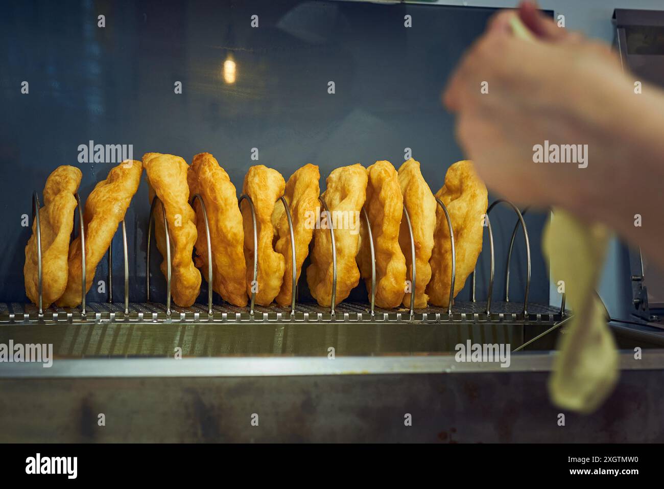 Langos, a typical Hungarian food. Deep fried flatbread in oil Stock ...