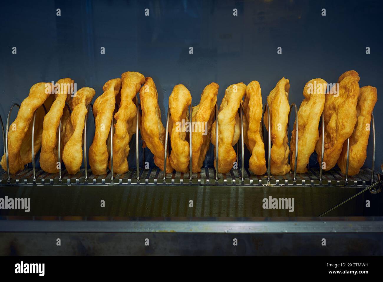 Langos, a typical Hungarian food. Deep fried flatbread in oil Stock ...