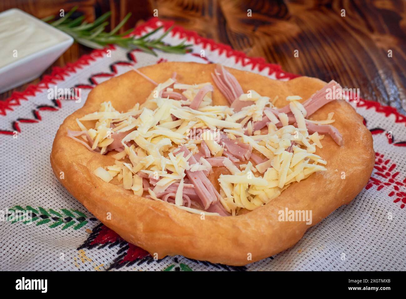 Langos with cheese and bacon, a typical Hungarian food. Deep fried ...