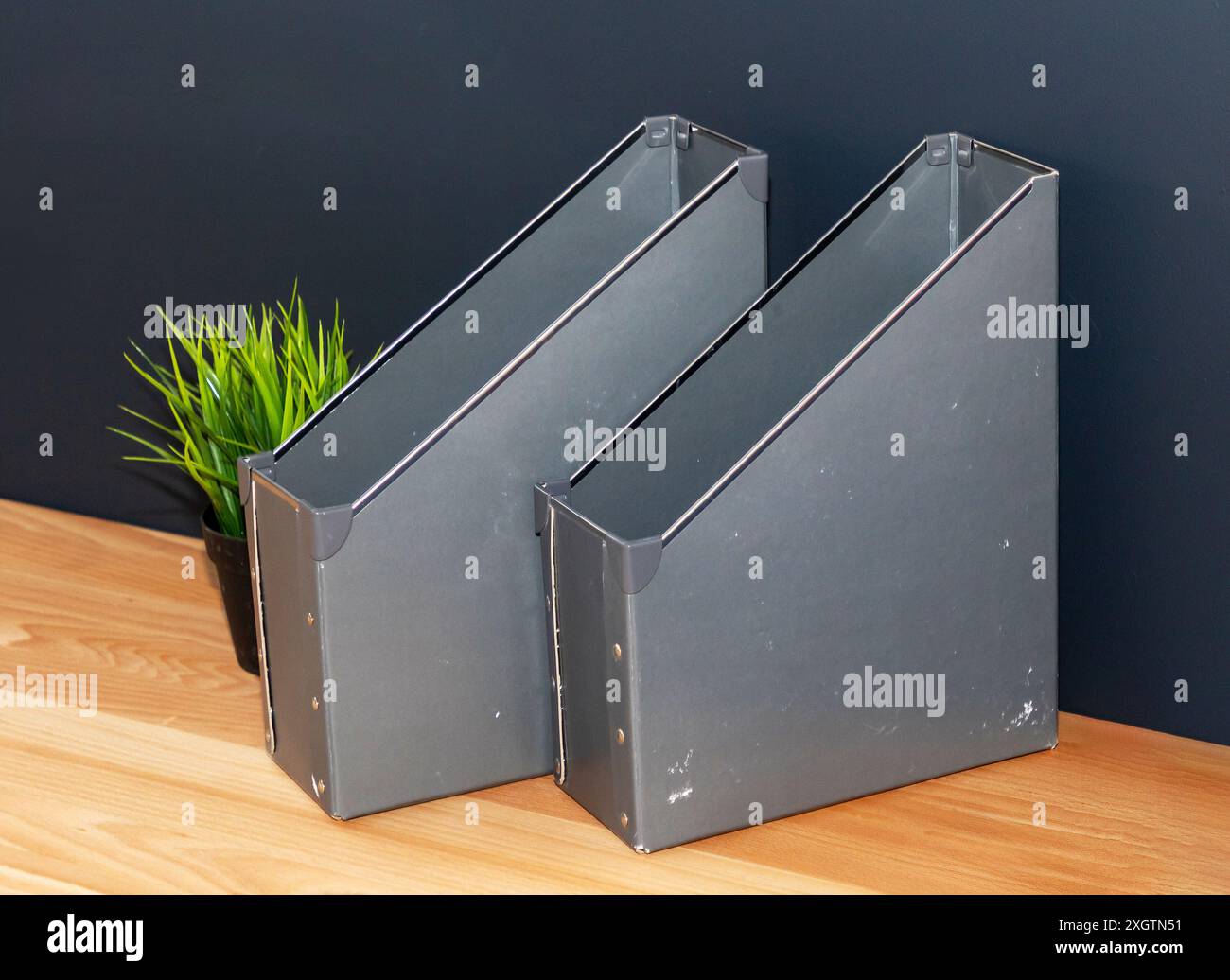 Cardboard office document holders on table interior Stock Photo - Alamy