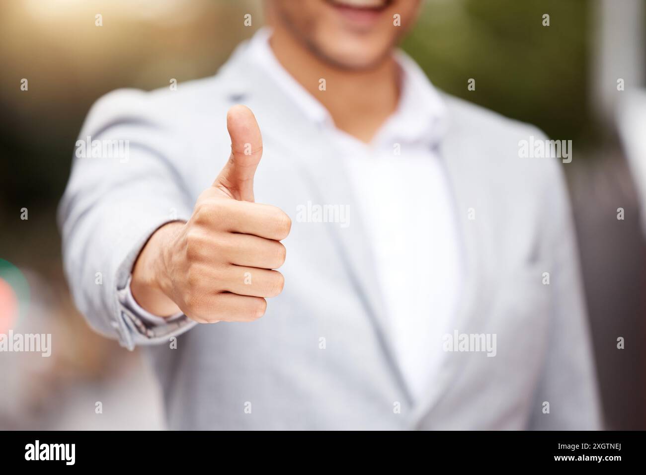 Businessman, hand and thumbs up in outdoor for approval, support and ...