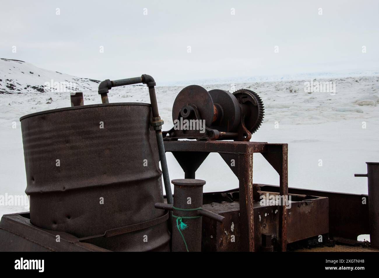 Barrel and winch on the rusty steel barge on Red Boat Beach in Apex ...