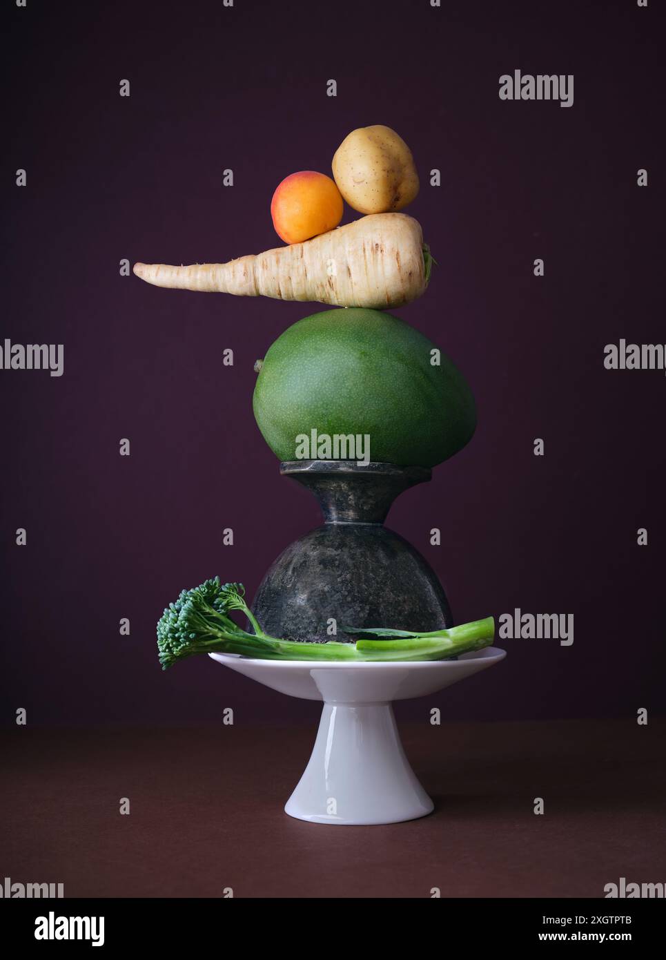 An imaginative arrangement of vegetables, featuring a parsnip, potato ...