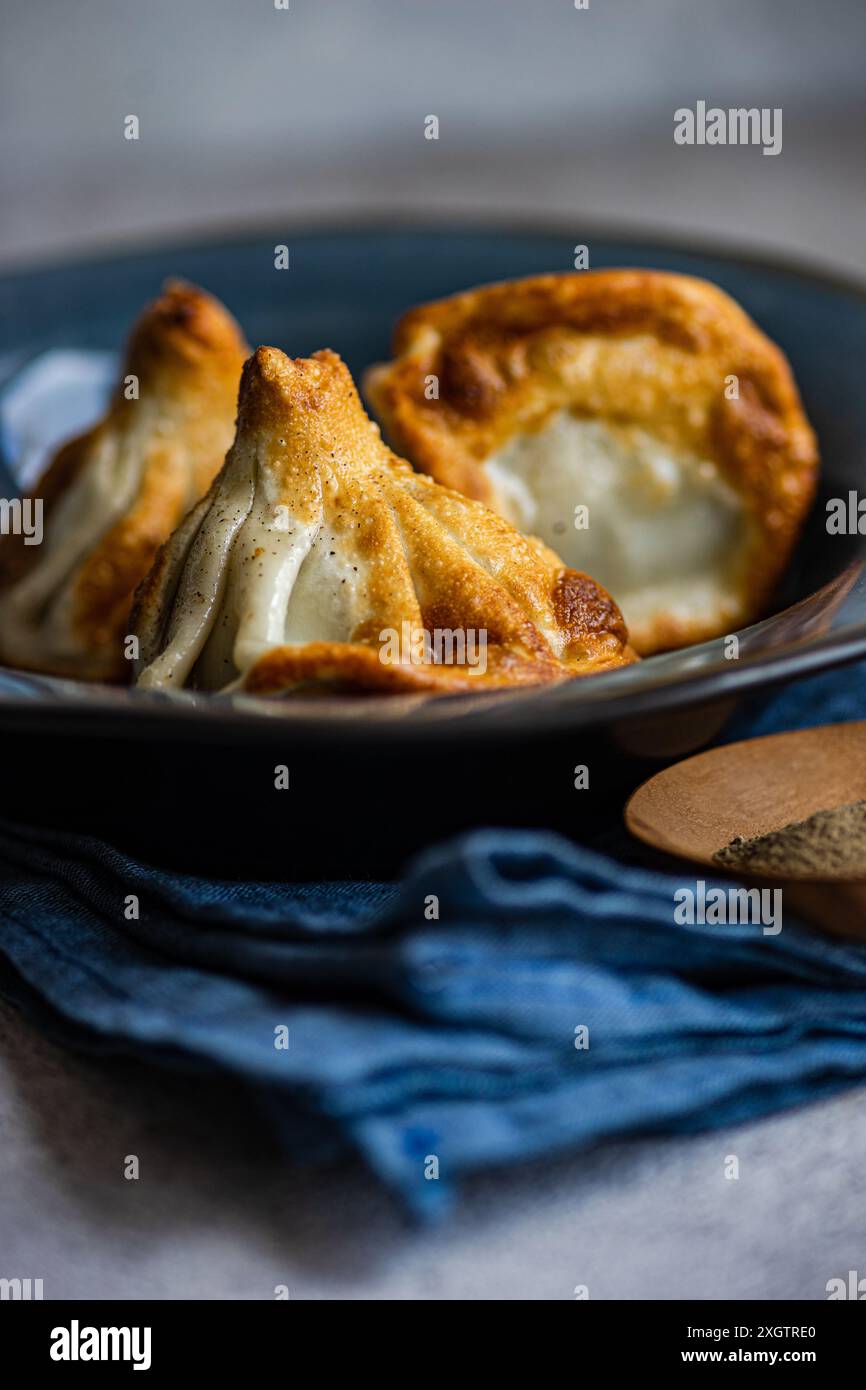 A close-up shot of freshly cooked traditional Georgian Khinkali, served ...