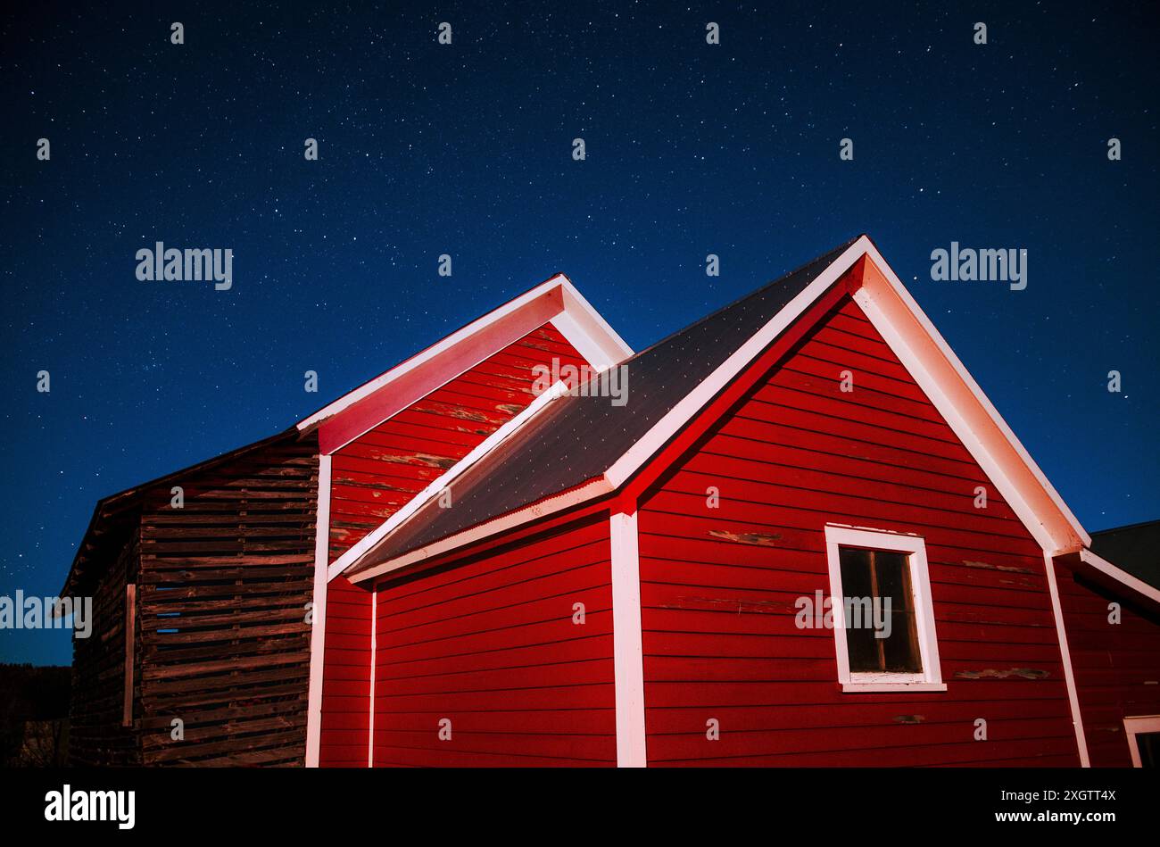 Starry sky over a bright red farm building, Sleeping Bear Dunes ...