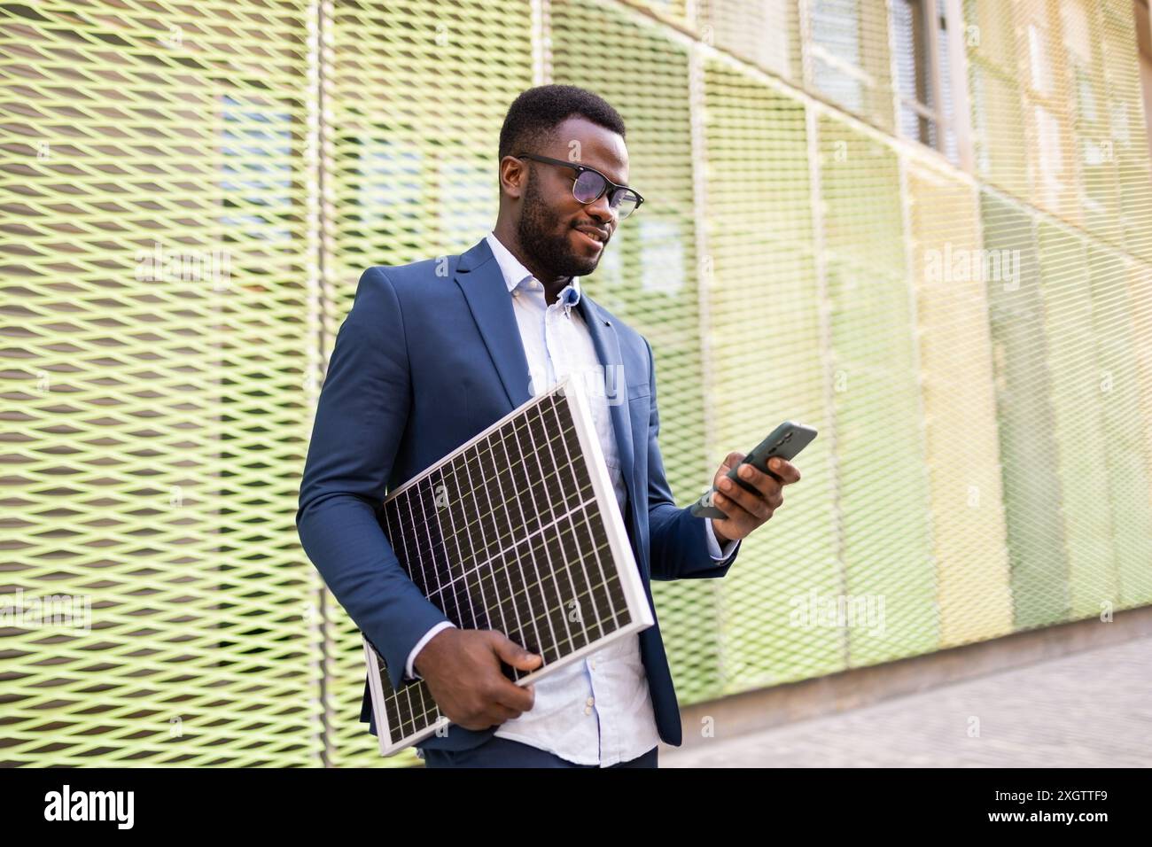 African man holding solar panel hi-res stock photography and images - Alamy