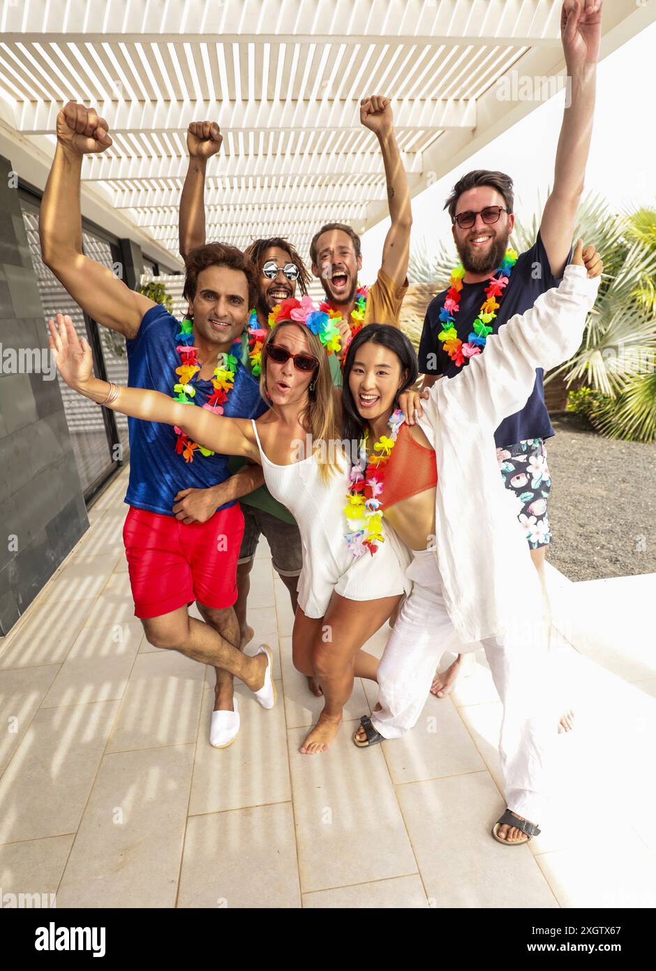 A lively and diverse group of six friends celebrate summertime together ...