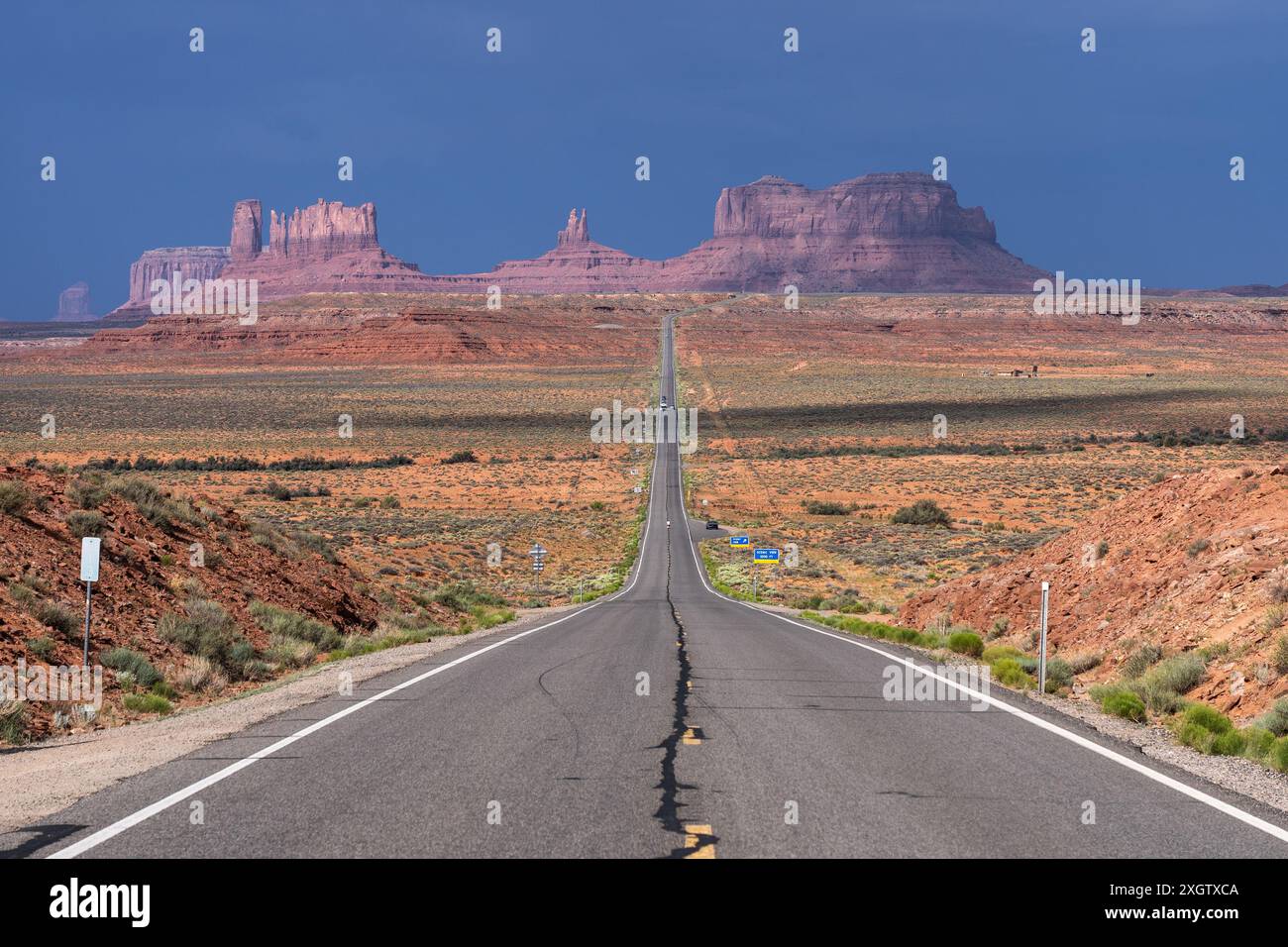 Scenic view of a straight road stretching towards the iconic red ...