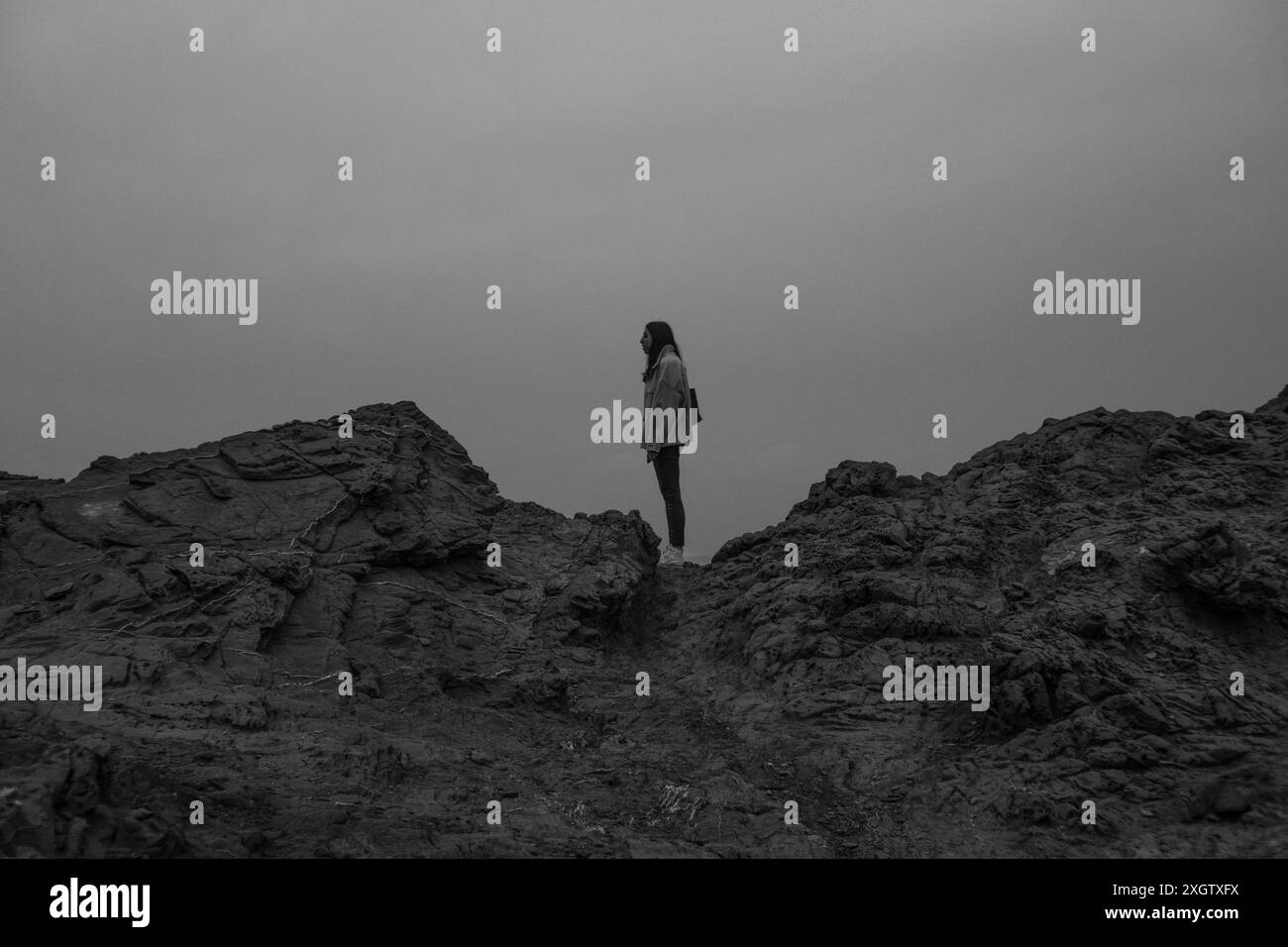 Woman stands alone Black and White Stock Photos & Images - Alamy