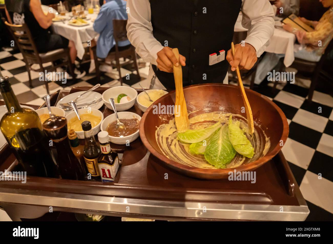 Tijuana, Mexico. 08th July, 2024. An employee of Caesar's restaurant ...