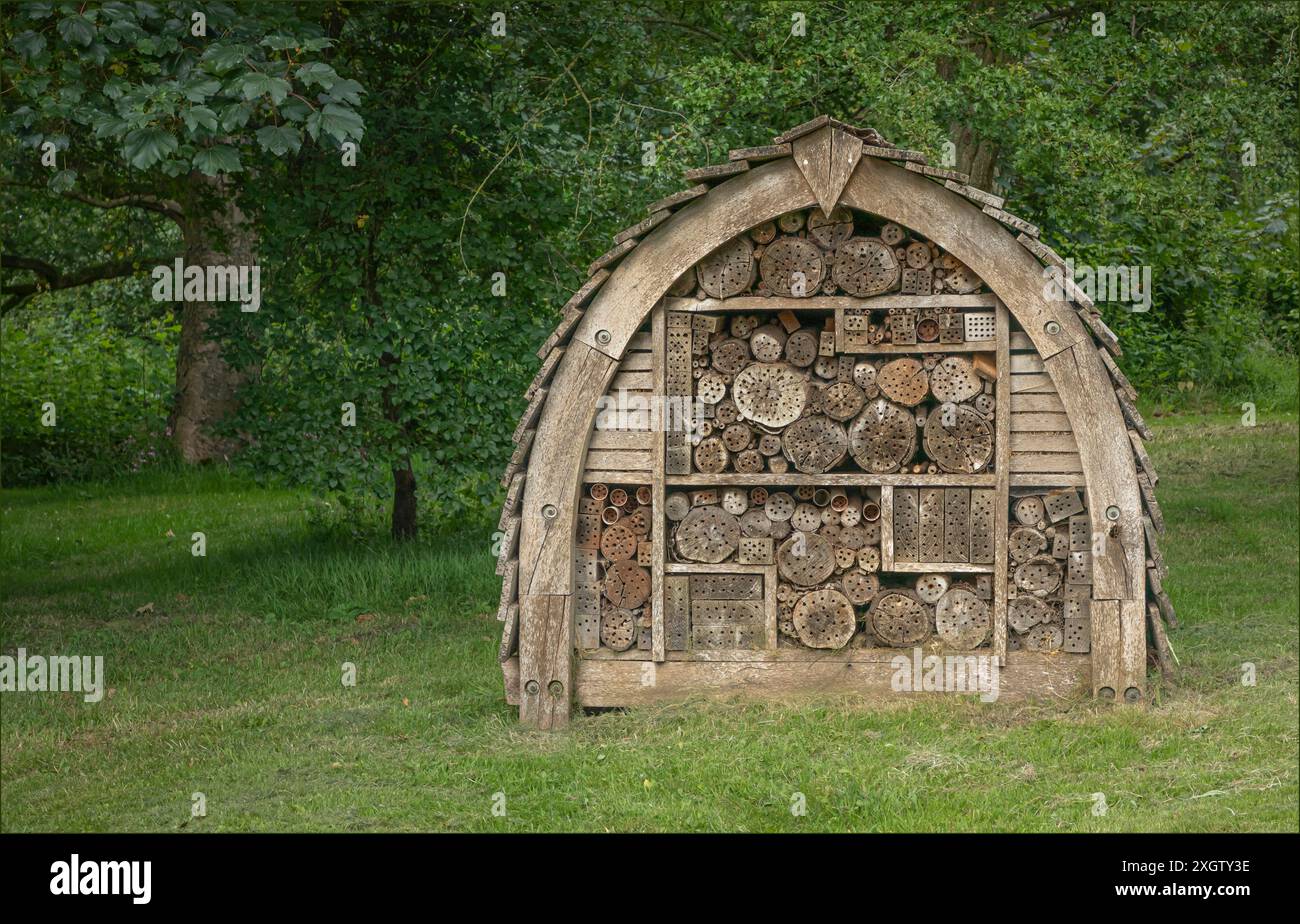 Large arched bug house in the garden of a stately home on a verge near ...