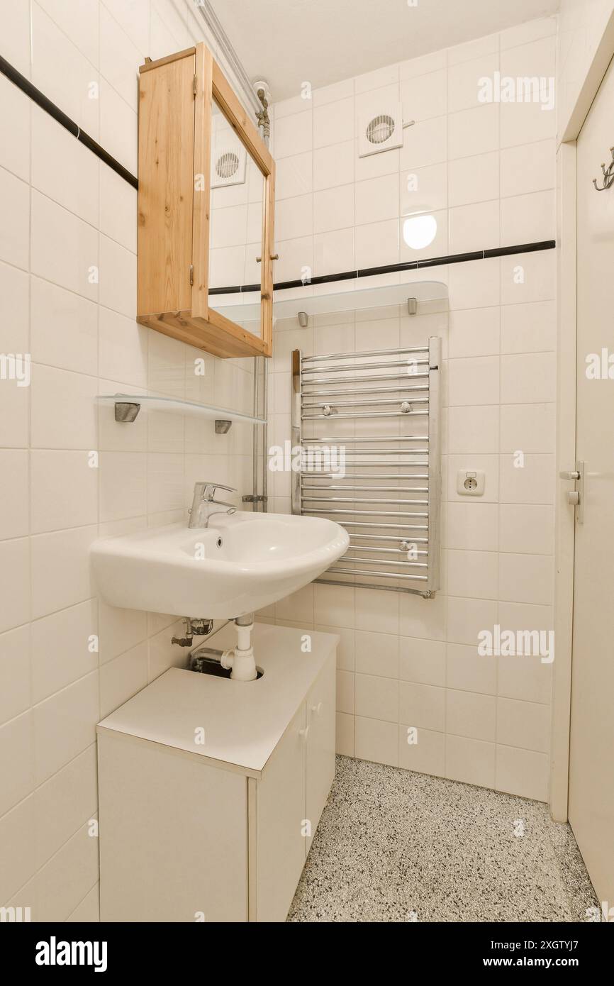 This image showcases a compact and minimalist bathroom design located ...