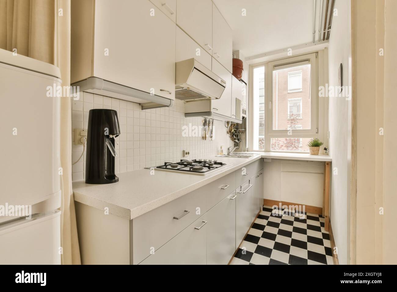 A modern, efficiently designed kitchen space located in Joan Melchior ...