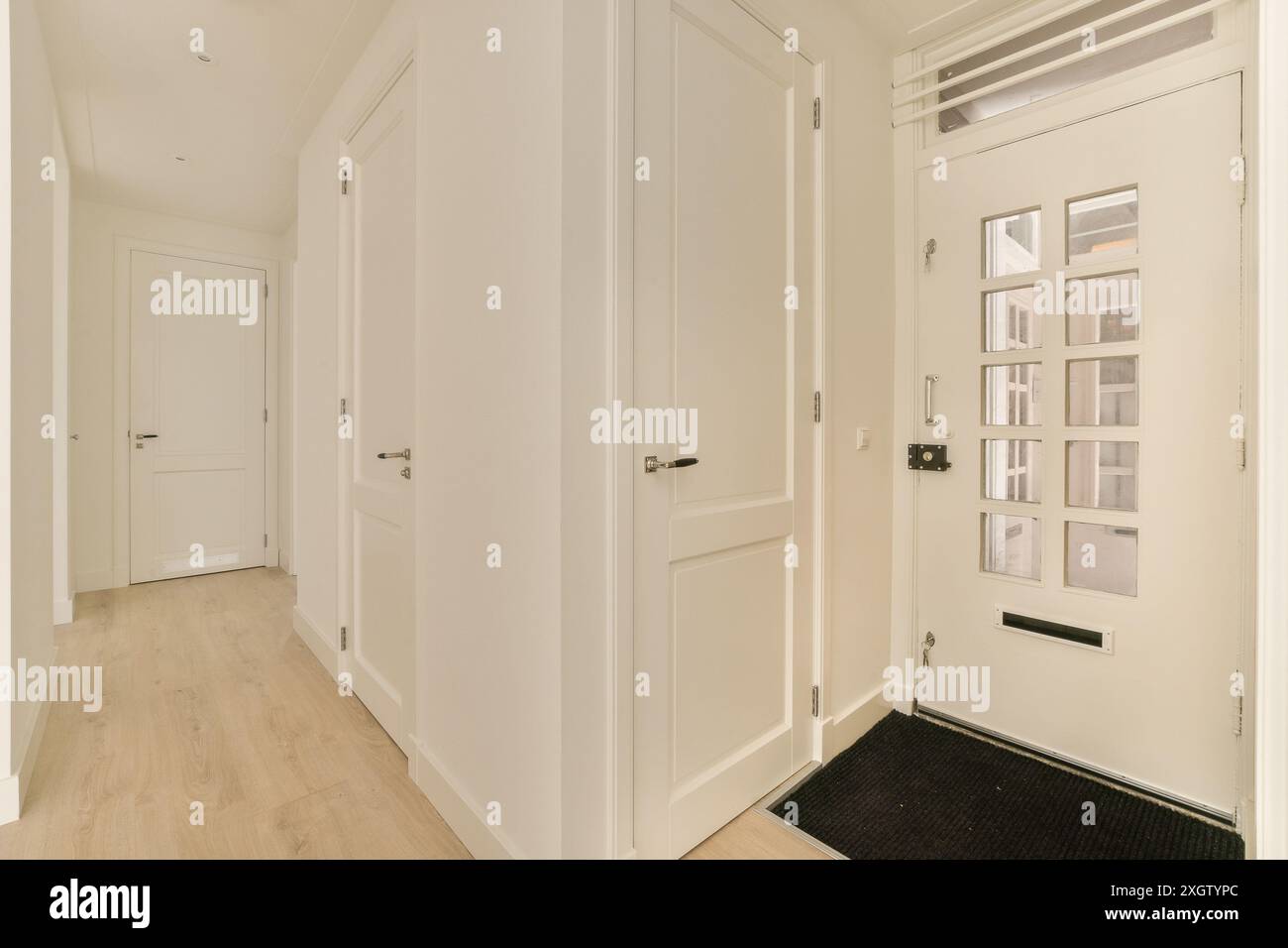 Bright and spacious home interior showcasing an elegant white entryway ...