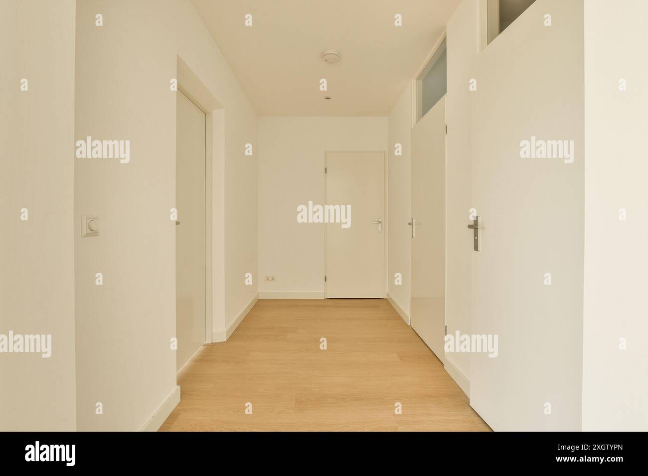 A sleek and simple hallway in a modern apartment located at Amerbos 106 ...