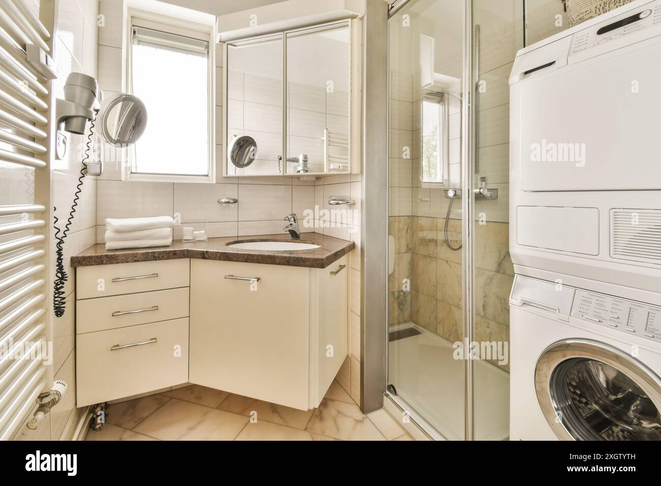 Compact modern bathroom design featuring a vanity, shower, and built-in ...