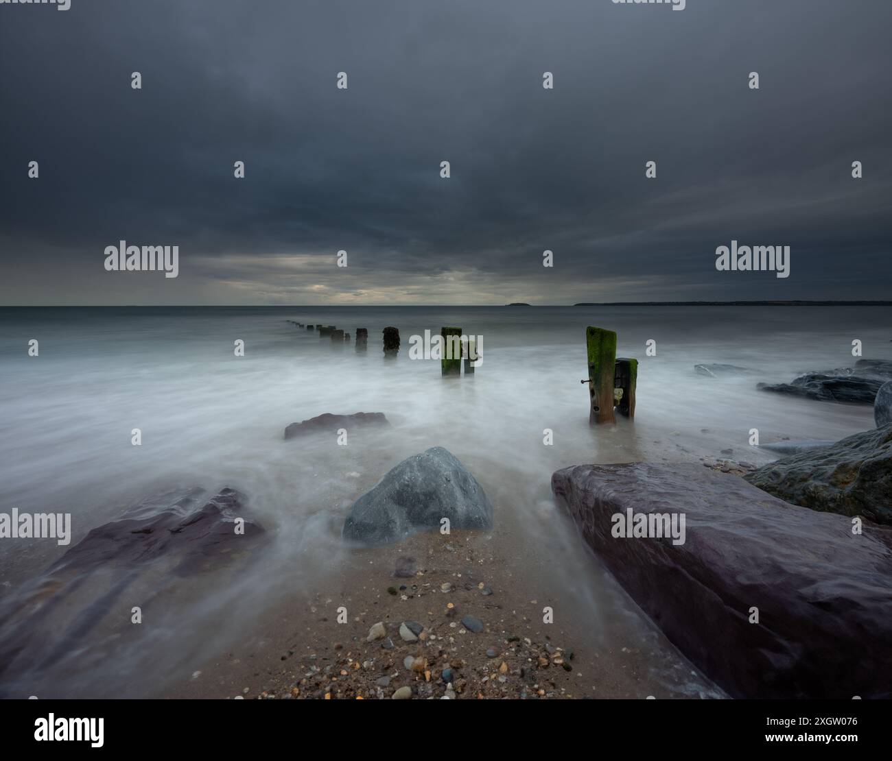 Youghal Strand Groynes on a wet summer evening Stock Photo - Alamy