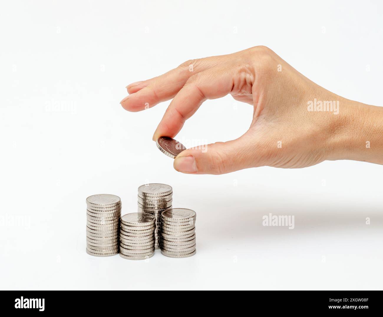 Hand stacks coins on a white background Stock Photo - Alamy Hand stacks coins on a white background Stock Photo - Alamy