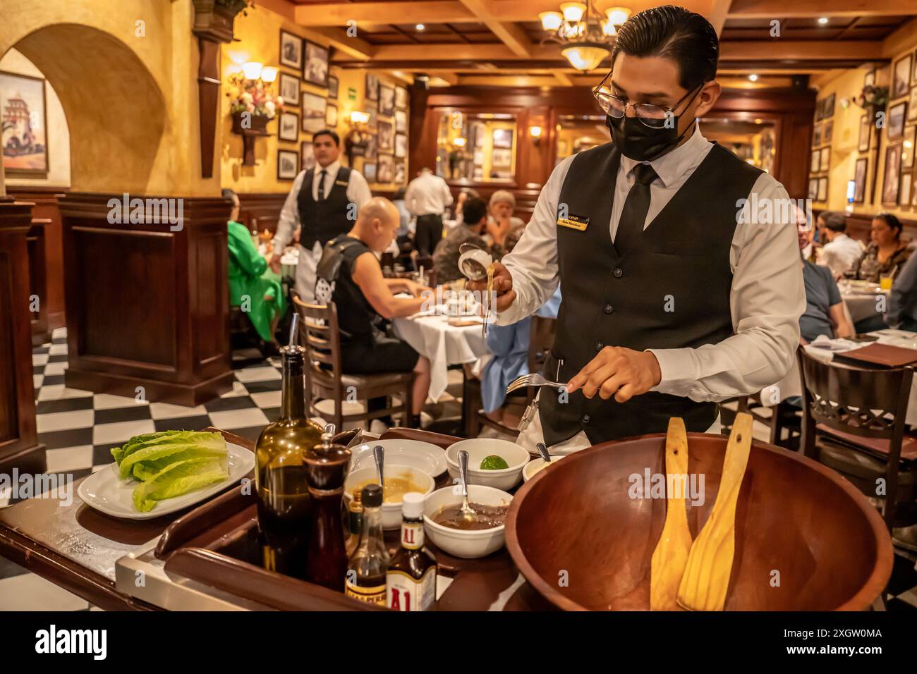 Tijuana, Mexico. 08th July, 2024. An employee of Caesar's restaurant ...