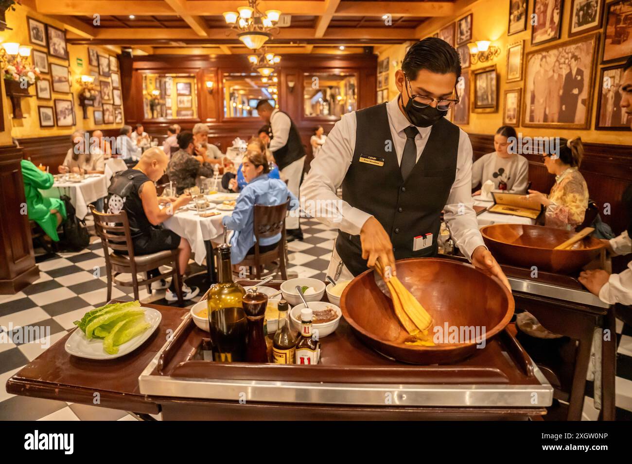 Tijuana, Mexico. 08th July, 2024. An employee of Caesar's restaurant ...