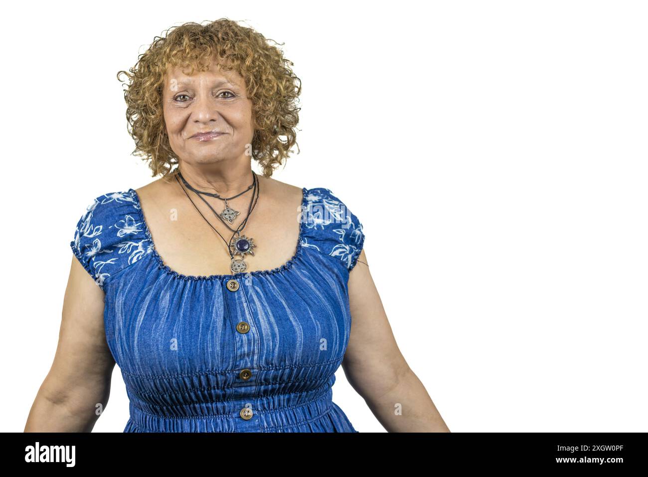 The image presents a sixty-year-old woman standing against a white ...