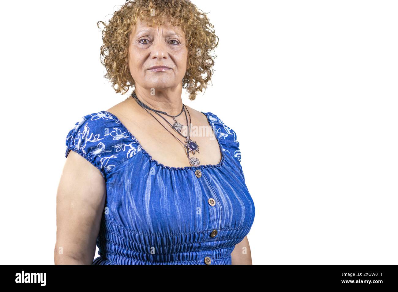 The image showcases a sixty-year-old woman standing against a white ...