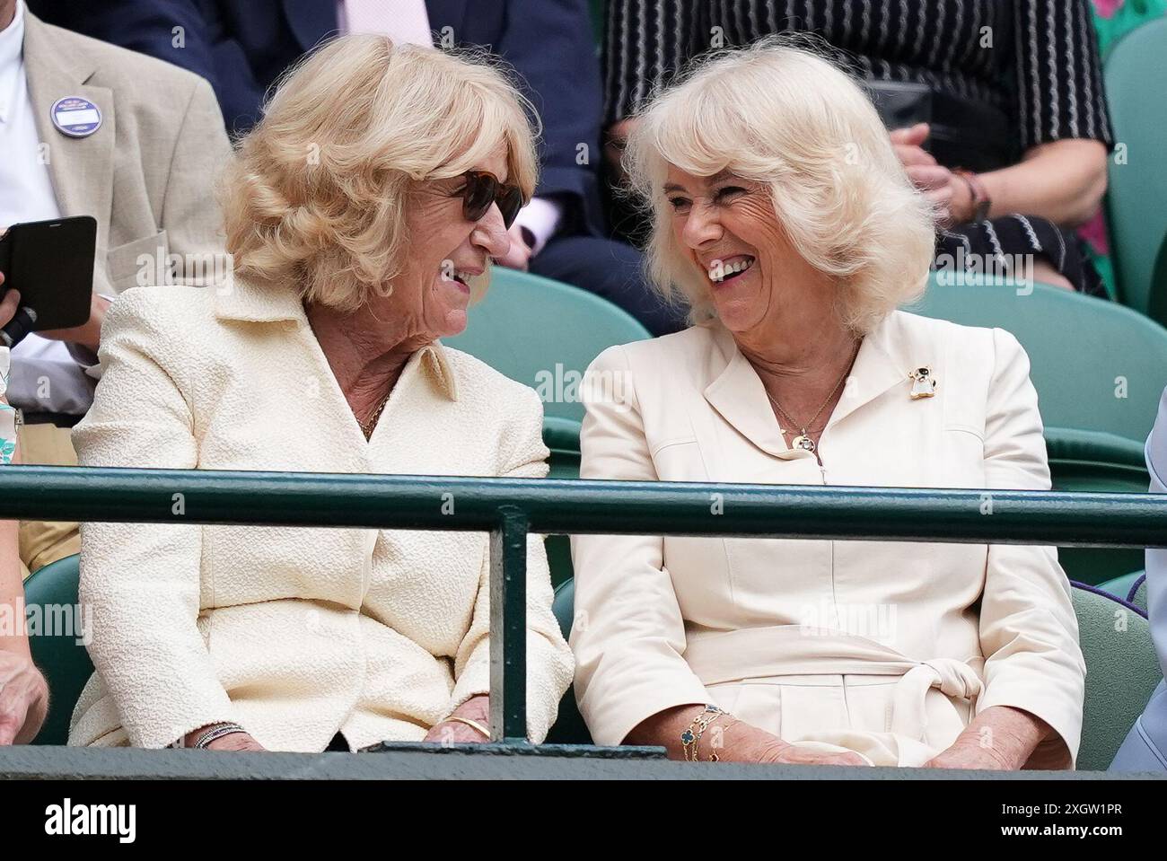 Queen Camilla (right) and Annabel Elliot in the stands of Court One on ...