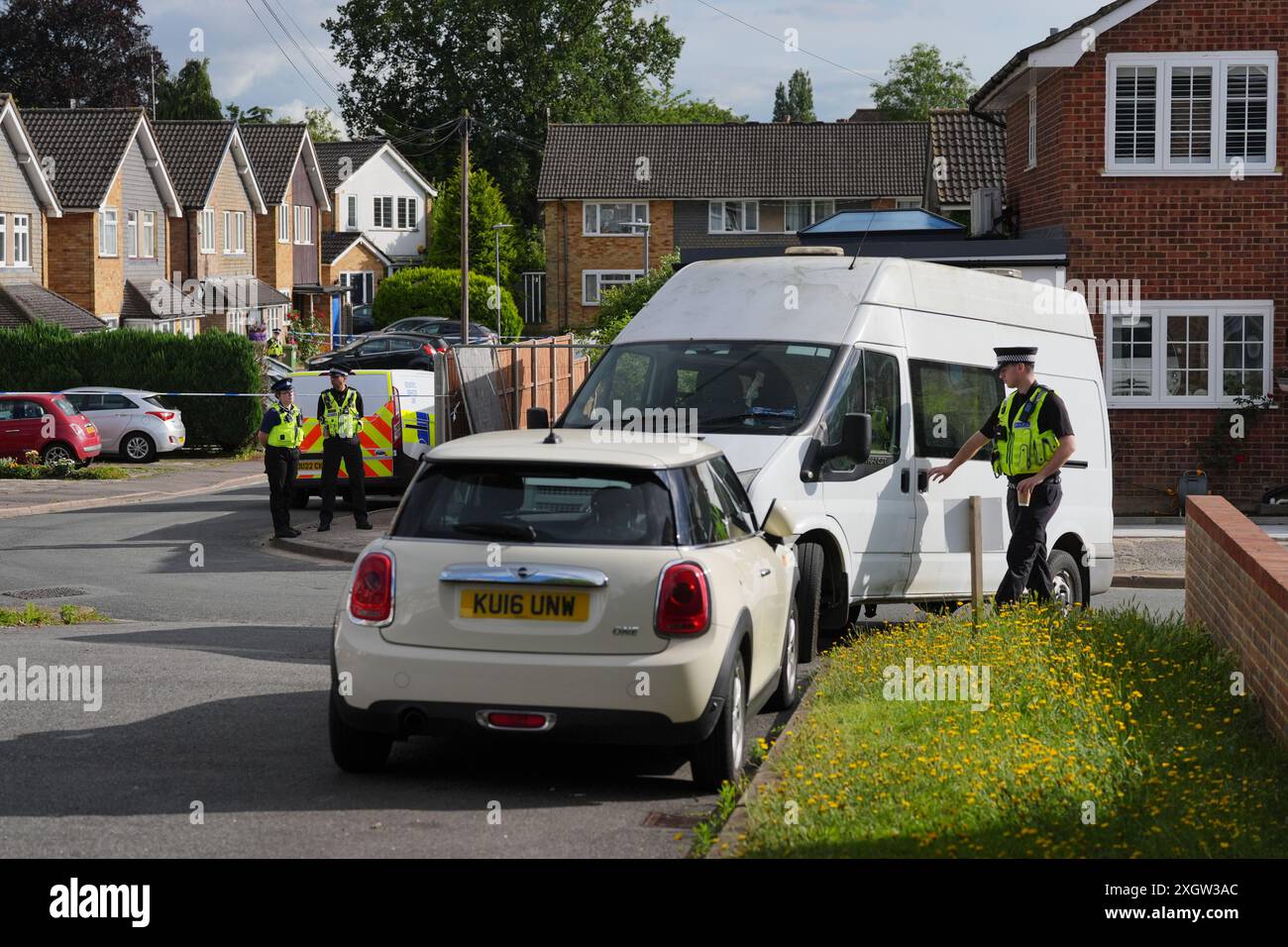 A view of police at the scene in Ashlyn Close, Bushey, Hertfordshire ...