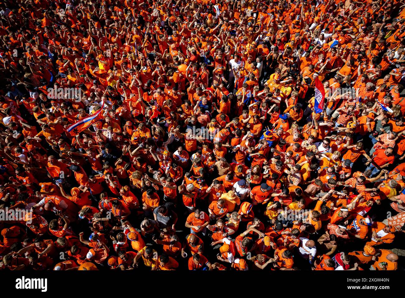 DORTMUND - Orange supporters walk behind the Orange bus during the fan ...