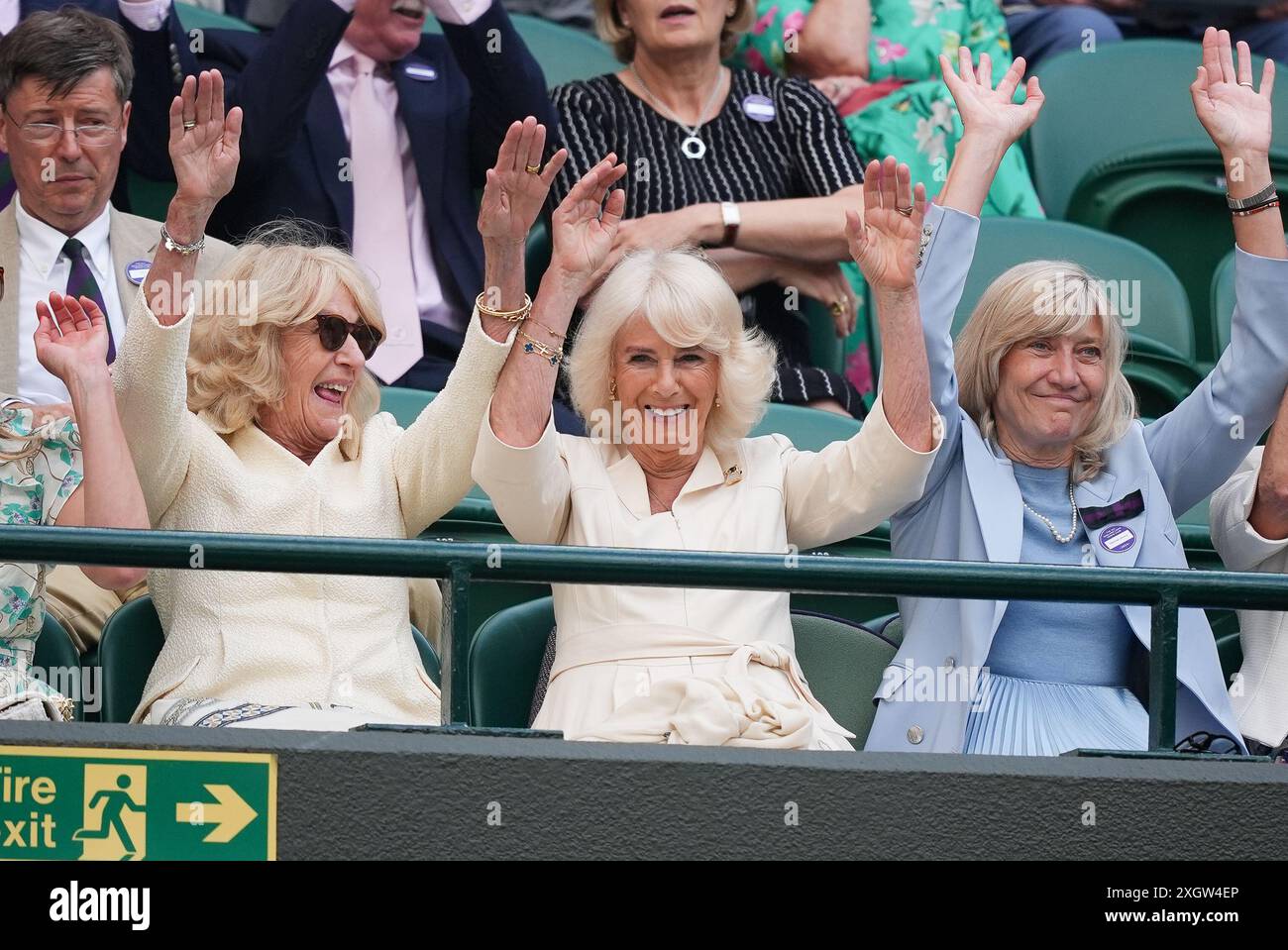 Queen Camilla (centre), Annabel Elliot (left), and Debbie Jevans chair ...