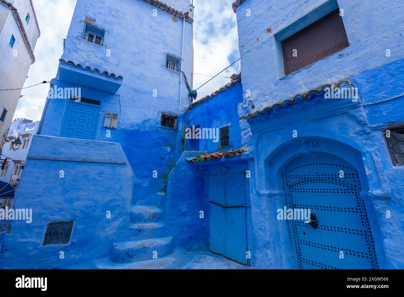 Under clear skies, the Chefchaouen alleys are a labyrinth of walls and ...