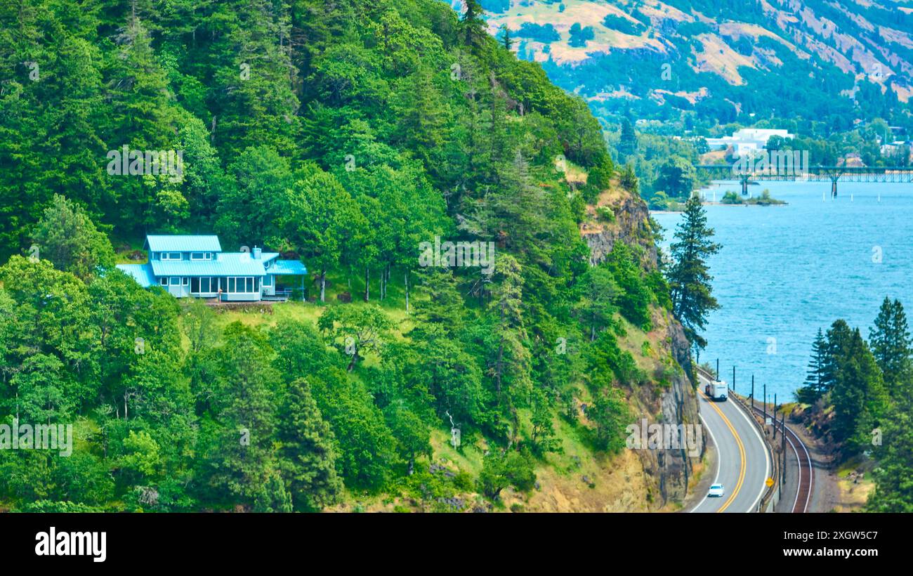 Aerial View Blue Roof House Overlooking River with Road and Rail Stock ...
