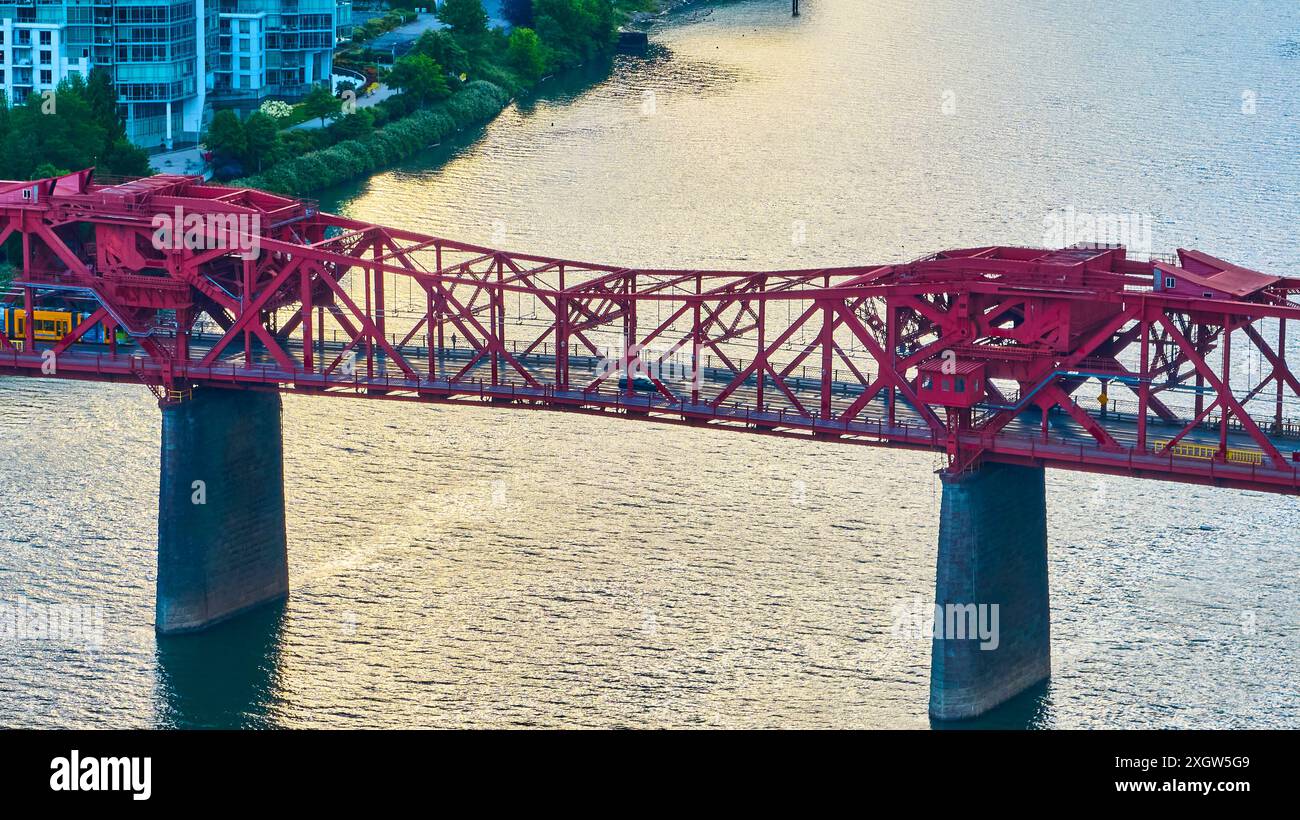 Aerial View of Red Truss Bridge with Yellow Tram at Golden Hour Stock ...