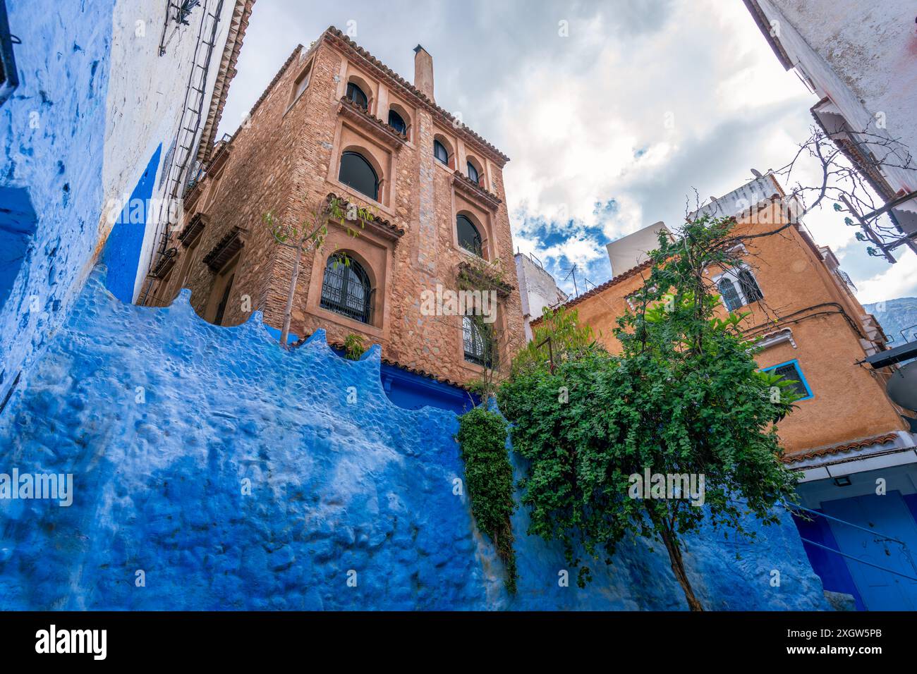 Under clear skies, the Chefchaouen alleys are a labyrinth of walls and ...
