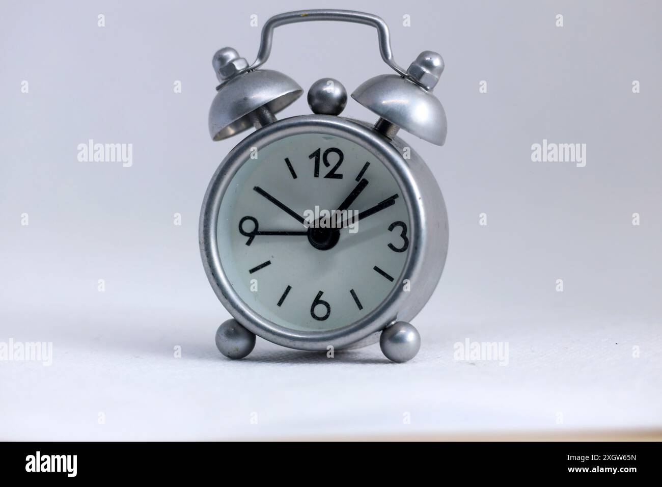 old-fashioned alarm clock with bells isolated working on time Stock ...