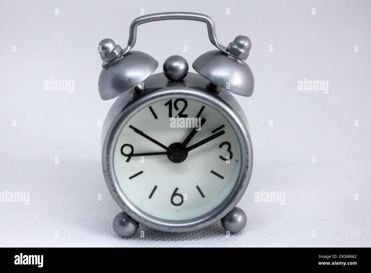 old-fashioned alarm clock with bells isolated working on time Stock ...