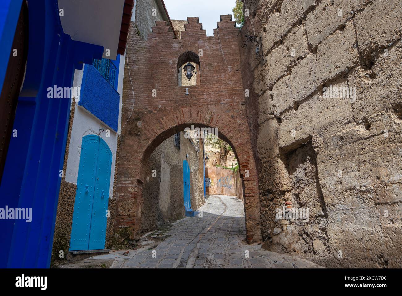Under clear skies, the Chefchaouen alleys are a labyrinth of walls and ...