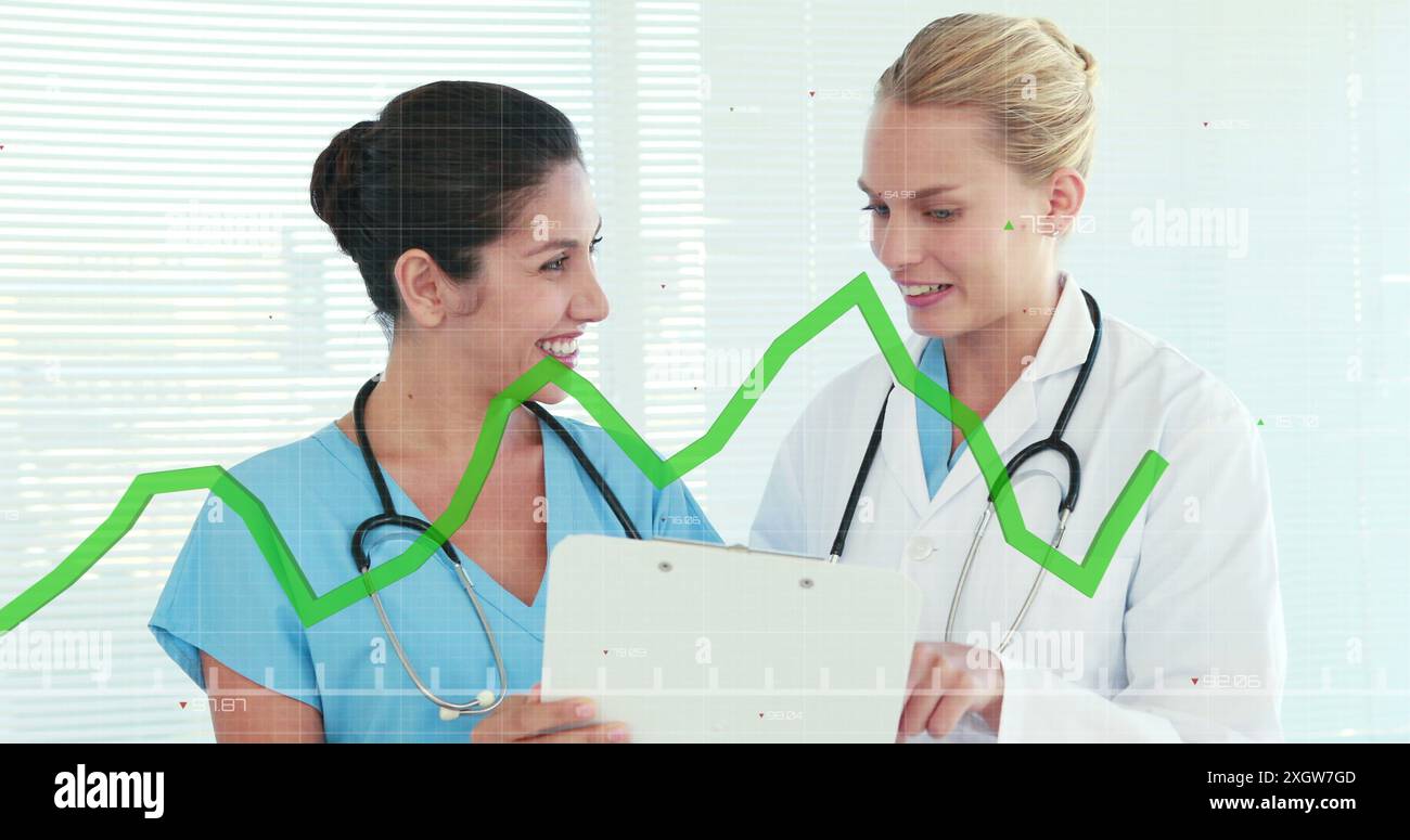 Image of financial graphs over happy caucasian female doctors talking ...