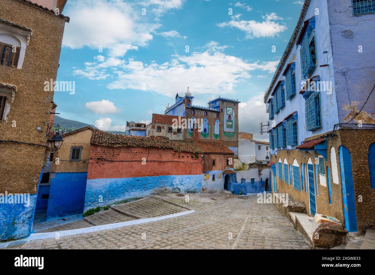 Under clear skies, the Chefchaouen alleys are a labyrinth of walls and ...