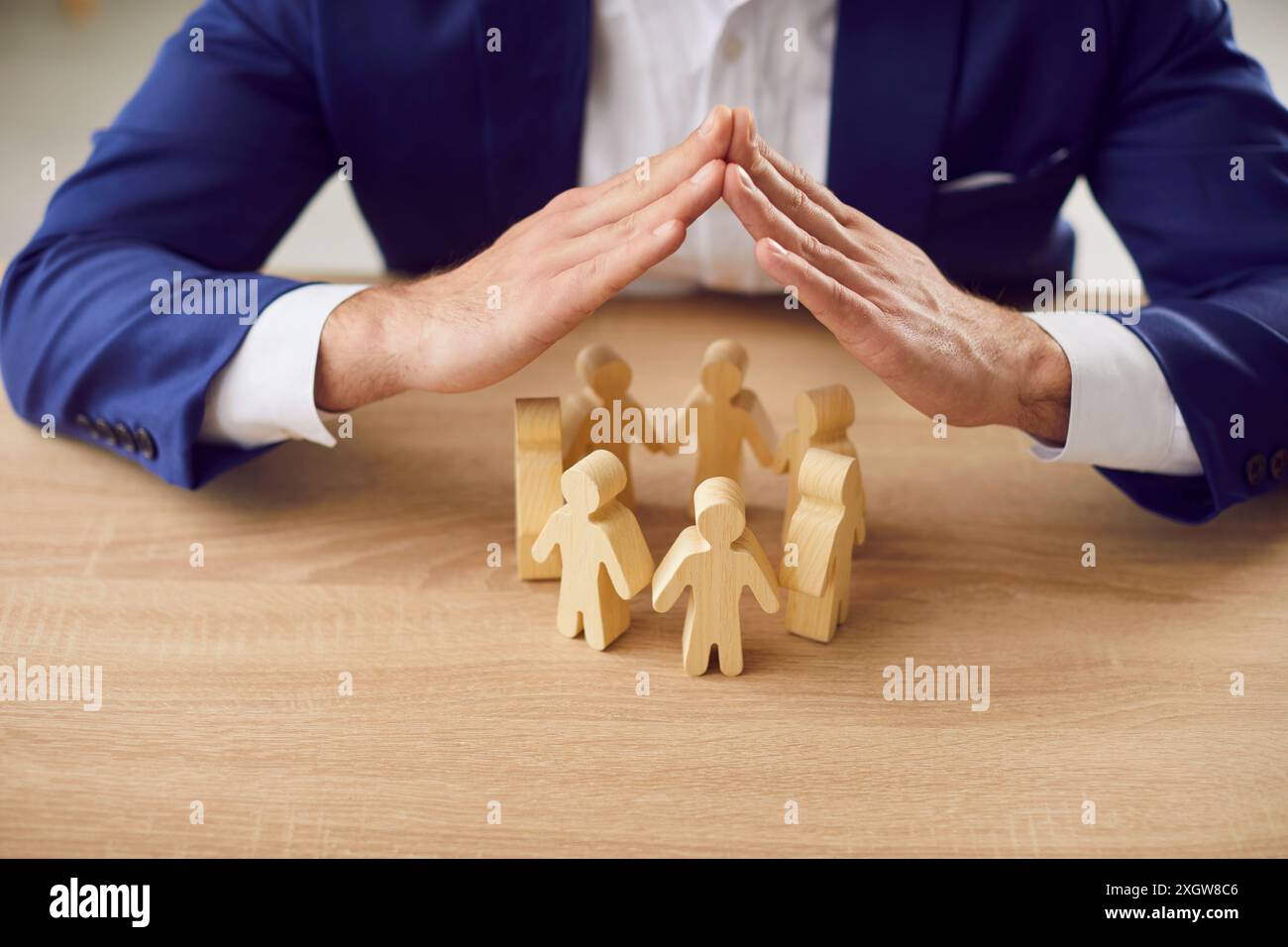 Employer holding hands over group of human figures showing concept of ...