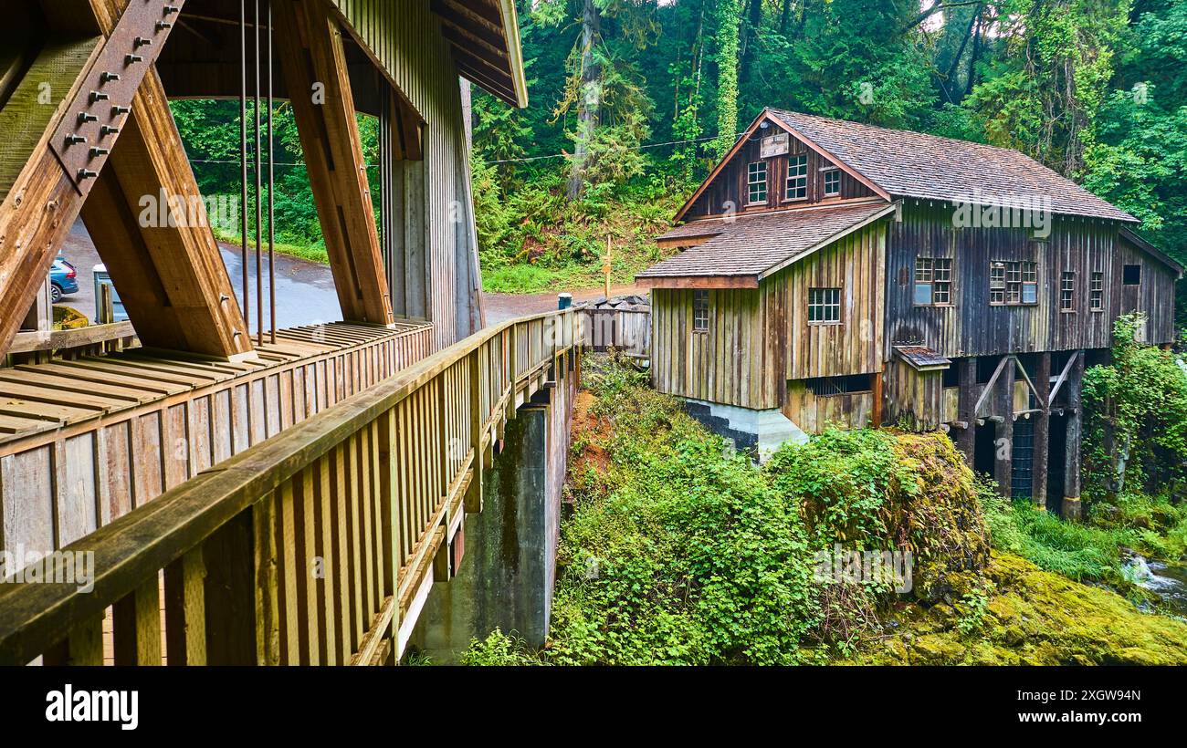 Aerial View of Rustic Mill and Covered Bridge in Lush Forest Stock ...