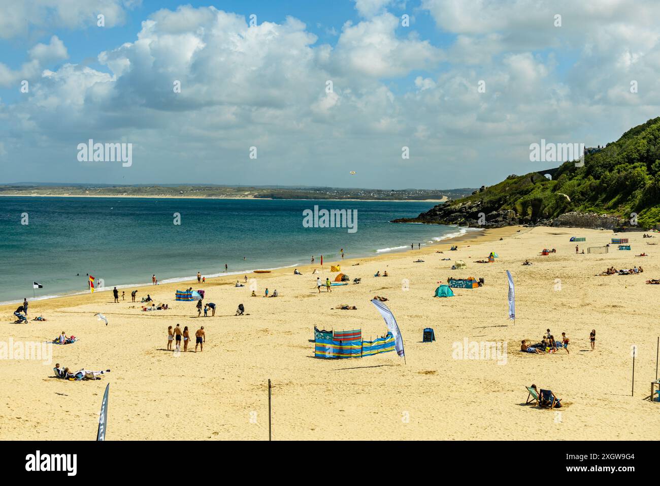 A relaxing day on the beach in front of St Ives Bay in beautiful ...