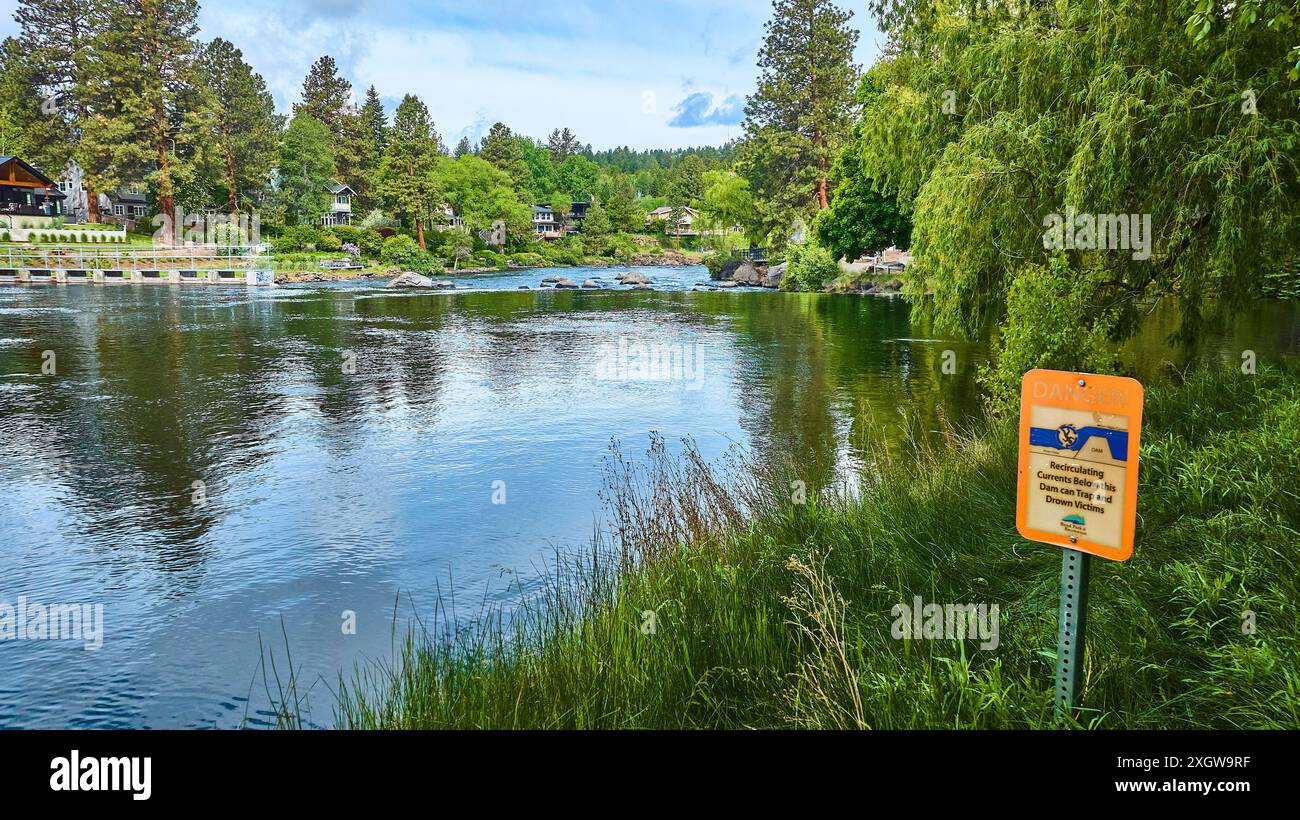 Aerial View Riverside Homes with Warning Sign and Lush Greenery Stock ...