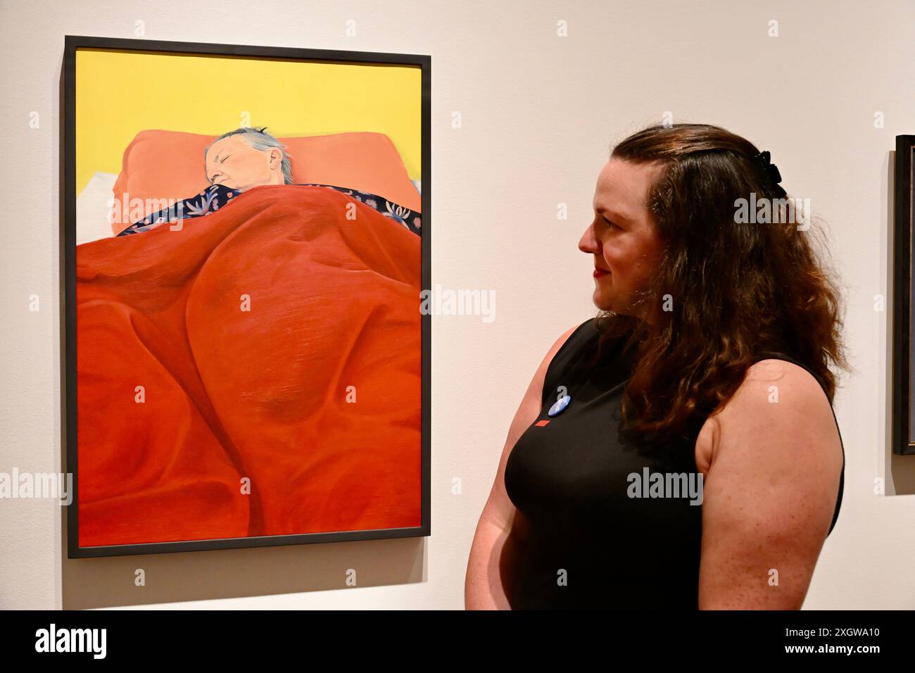 Artist Laura Carey observes her painting "I'll Never Not Miss You ...