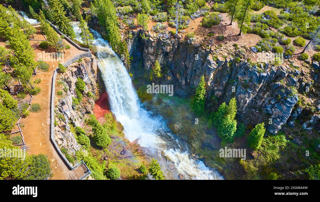 Aerial View of Tumalo Falls Cascading into Rocky Basin in Lush Forest ...